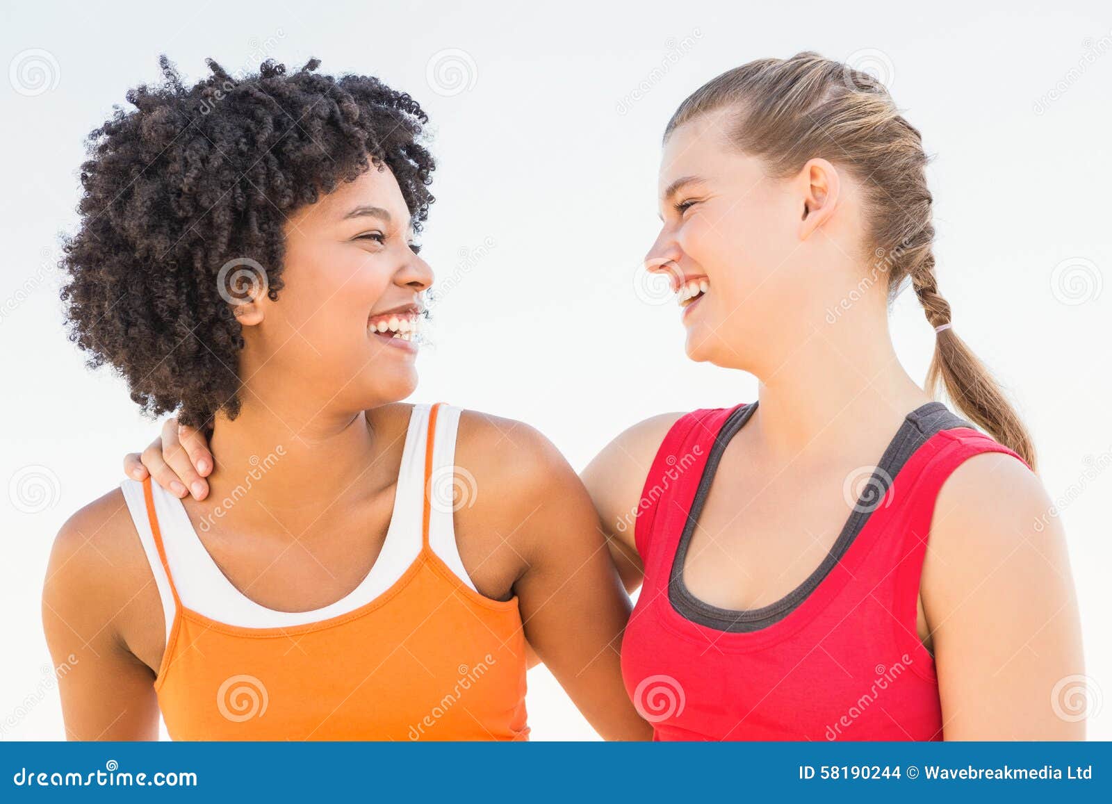 Two young women laughing stock photo. Image of friendship - 58190244