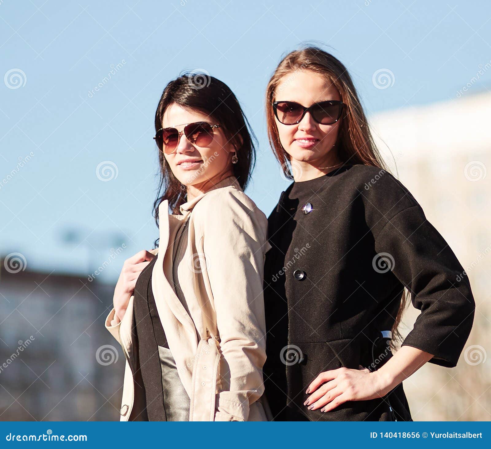 Two Young Women Looking at a Tall Office Building Stock Photo - Image ...