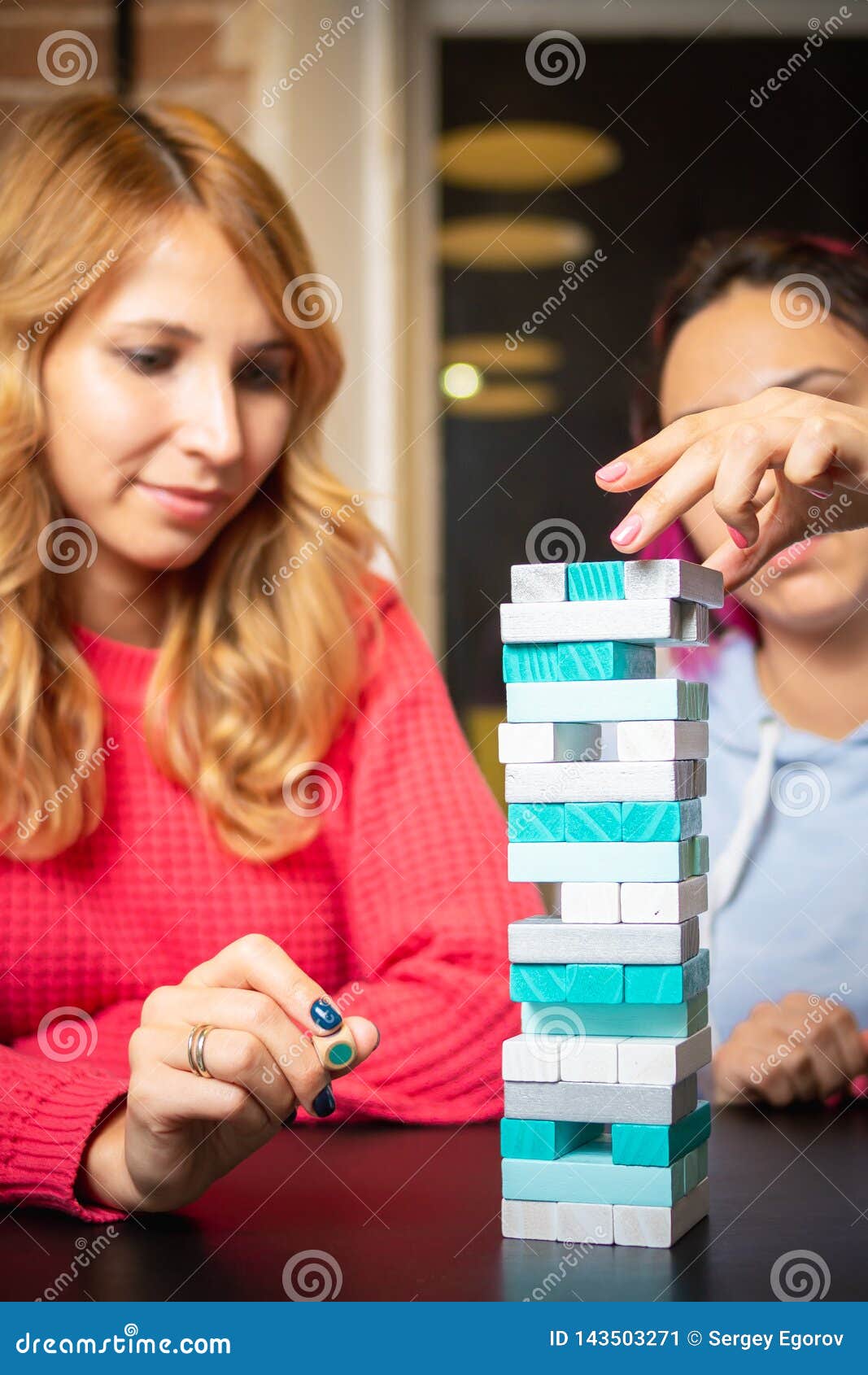 Two Young Women Playing Colored Jenga Stock Image - Image of people ...