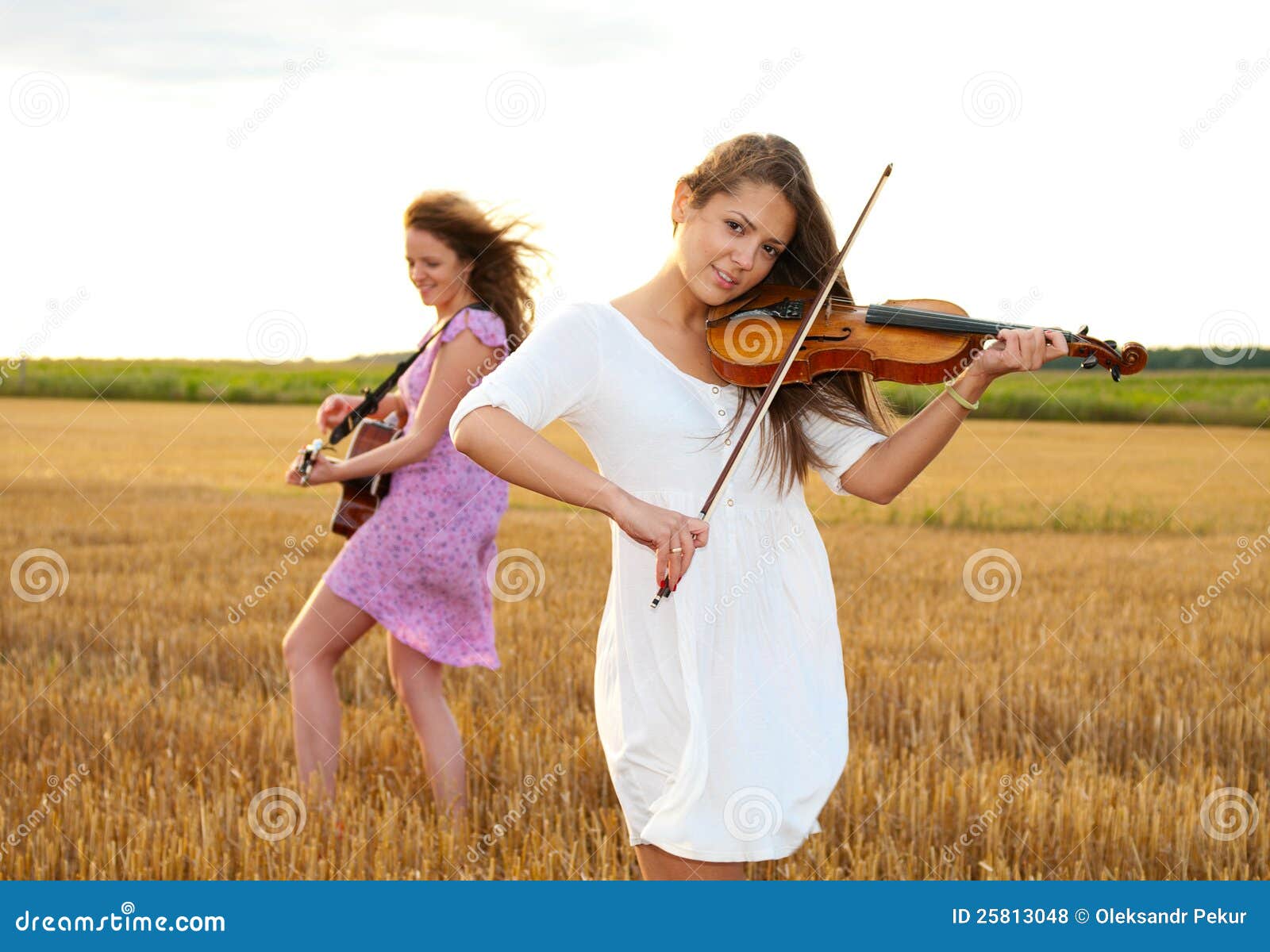 Two Young Women Playing Guitar Stock Photo - Image of women, play: 25813048