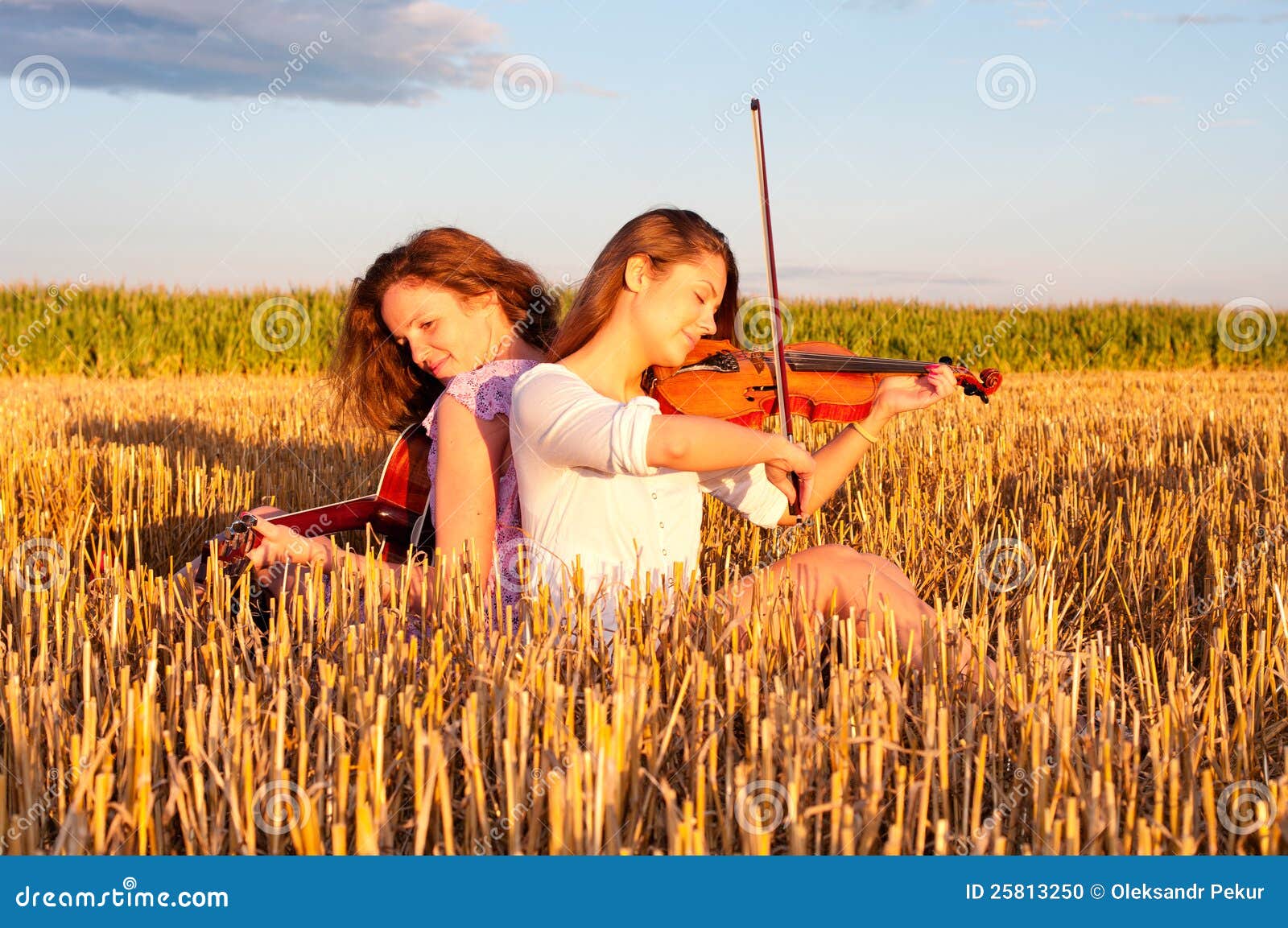 Two Young Women Playing Guitar Stock Photo - Image of young, instrument ...