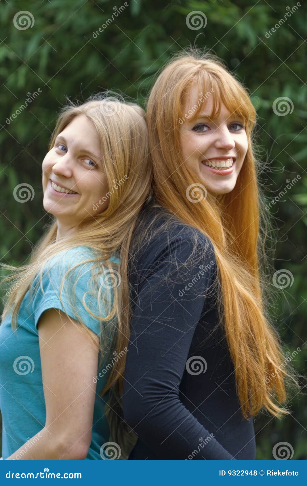 Two Young Women Standing Back To Back Stock Photo - Image of nature ...