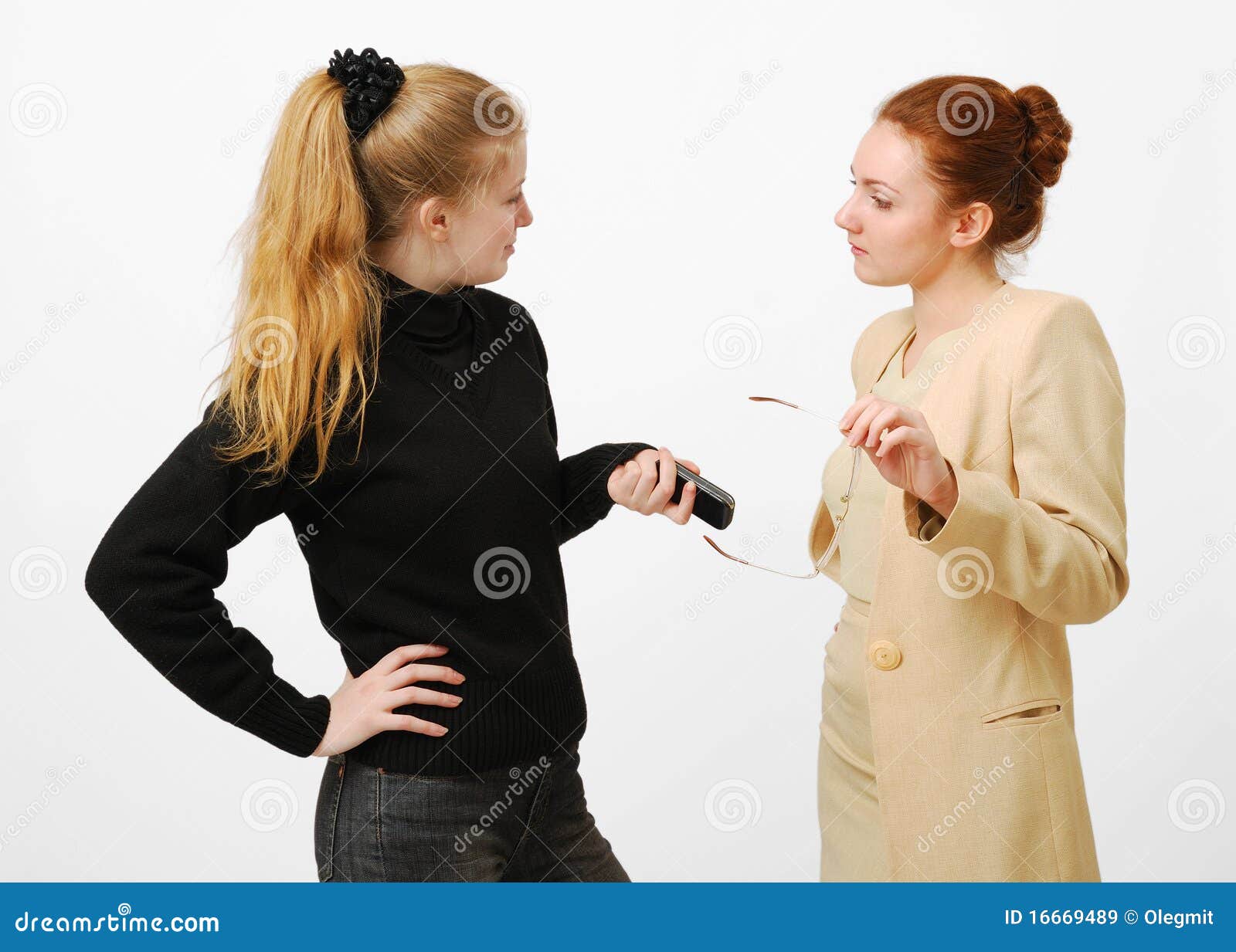 Two young women talking stock image. Image of talking - 16669489