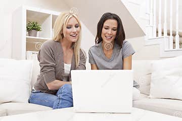 Two Young Women Using Laptop Computer at Home Stock Image - Image of ...