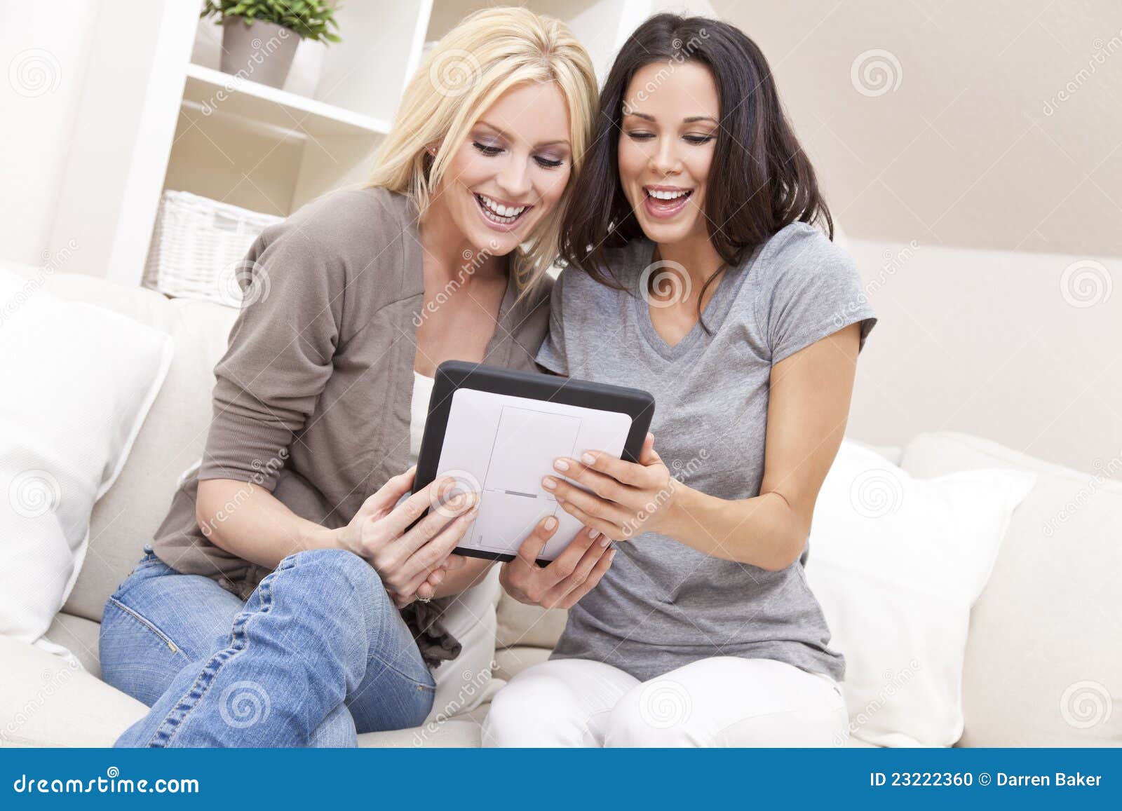 Two Young Women Using Tablet Computer at Home Stock Photo - Image of ...