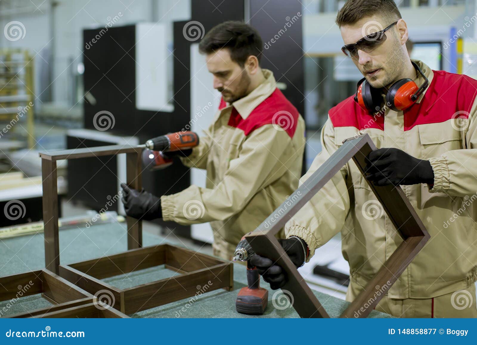 Two Young Workers Assembling Furniture in the Factory Stock Image ...