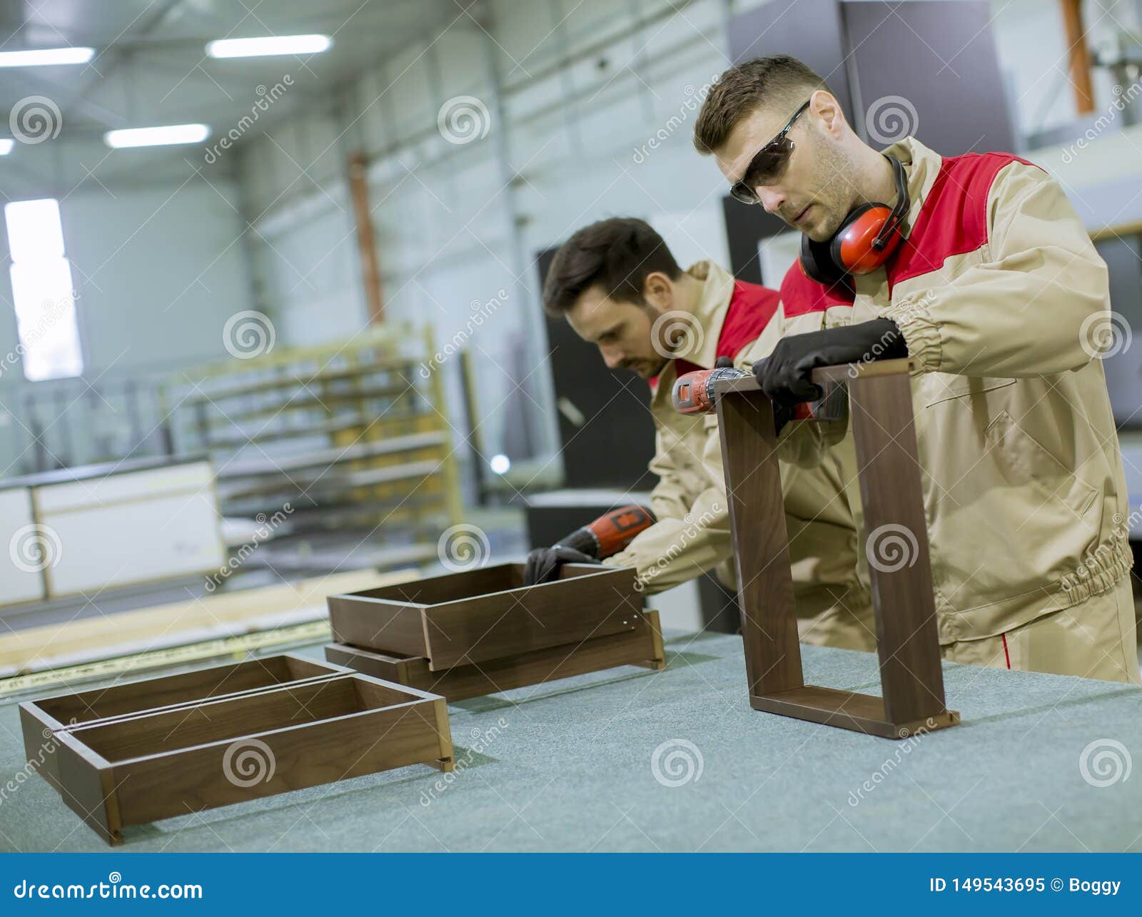 Two Young Workers Assembling Furniture in the Factory Stock Image ...