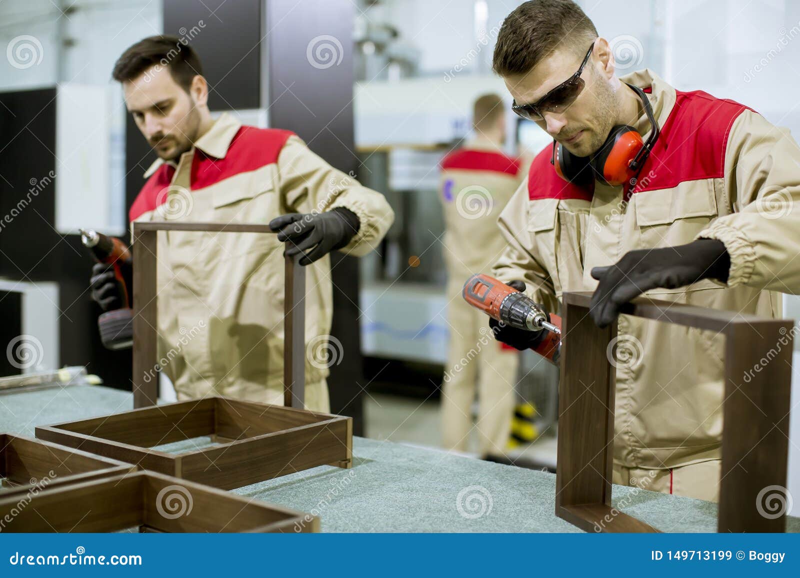 Two Young Workers Assembling Furniture in the Factory Stock Image ...
