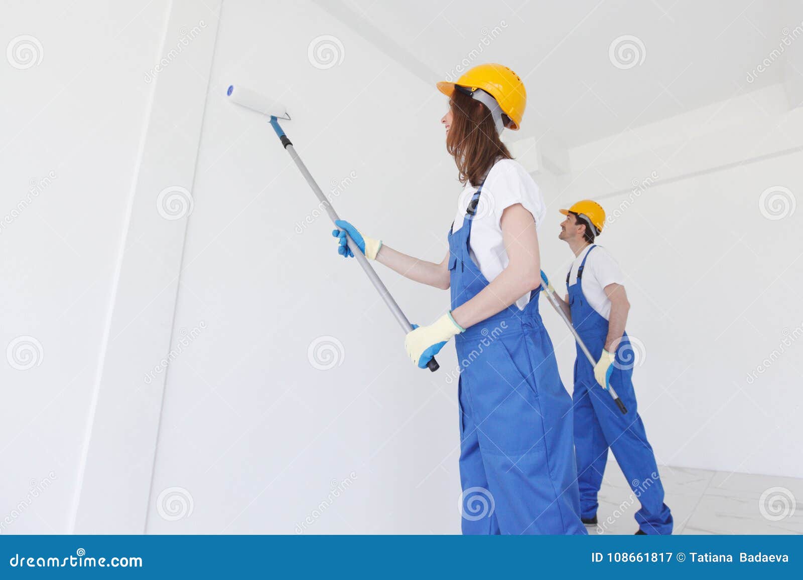 Workers painting the wall stock image. Image of painter - 108661817