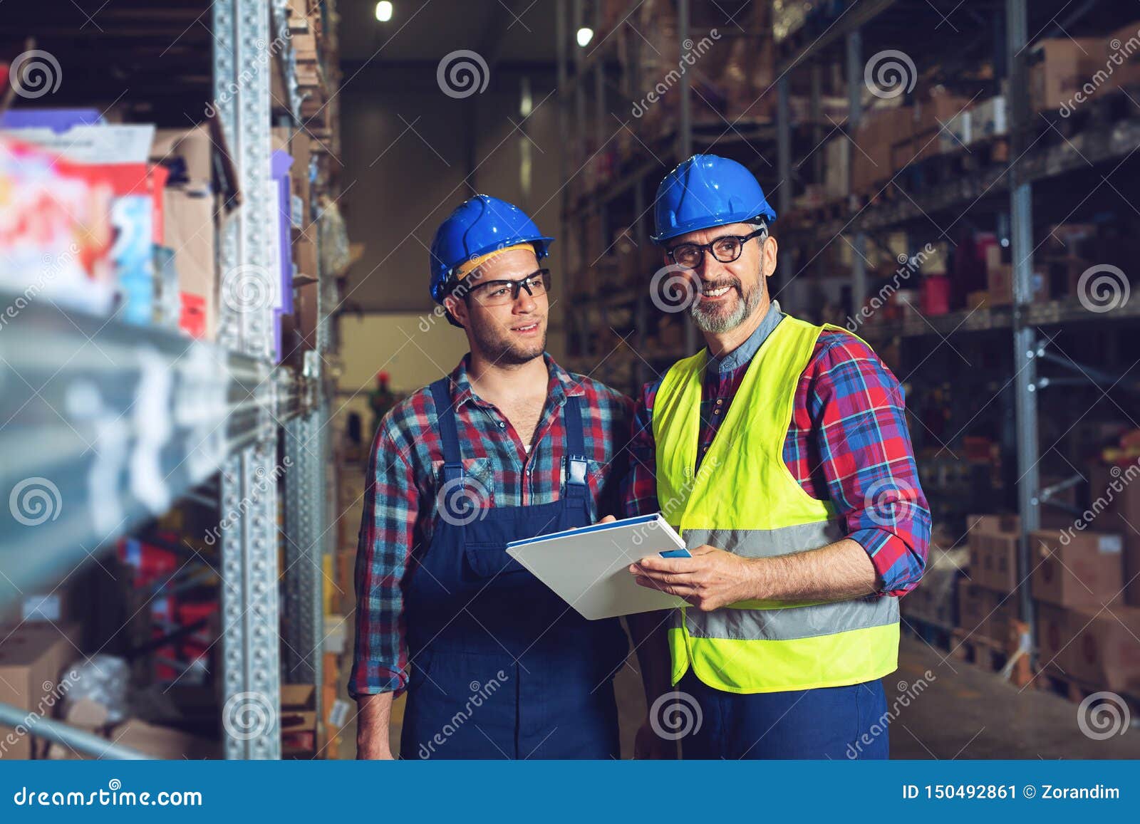 Two Warehouse Workers Filling in Document Stock Image - Image of ...