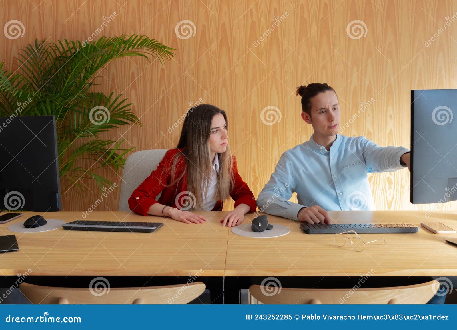 Two Young Workers Working Together in Modern Office Stock Image - Image ...