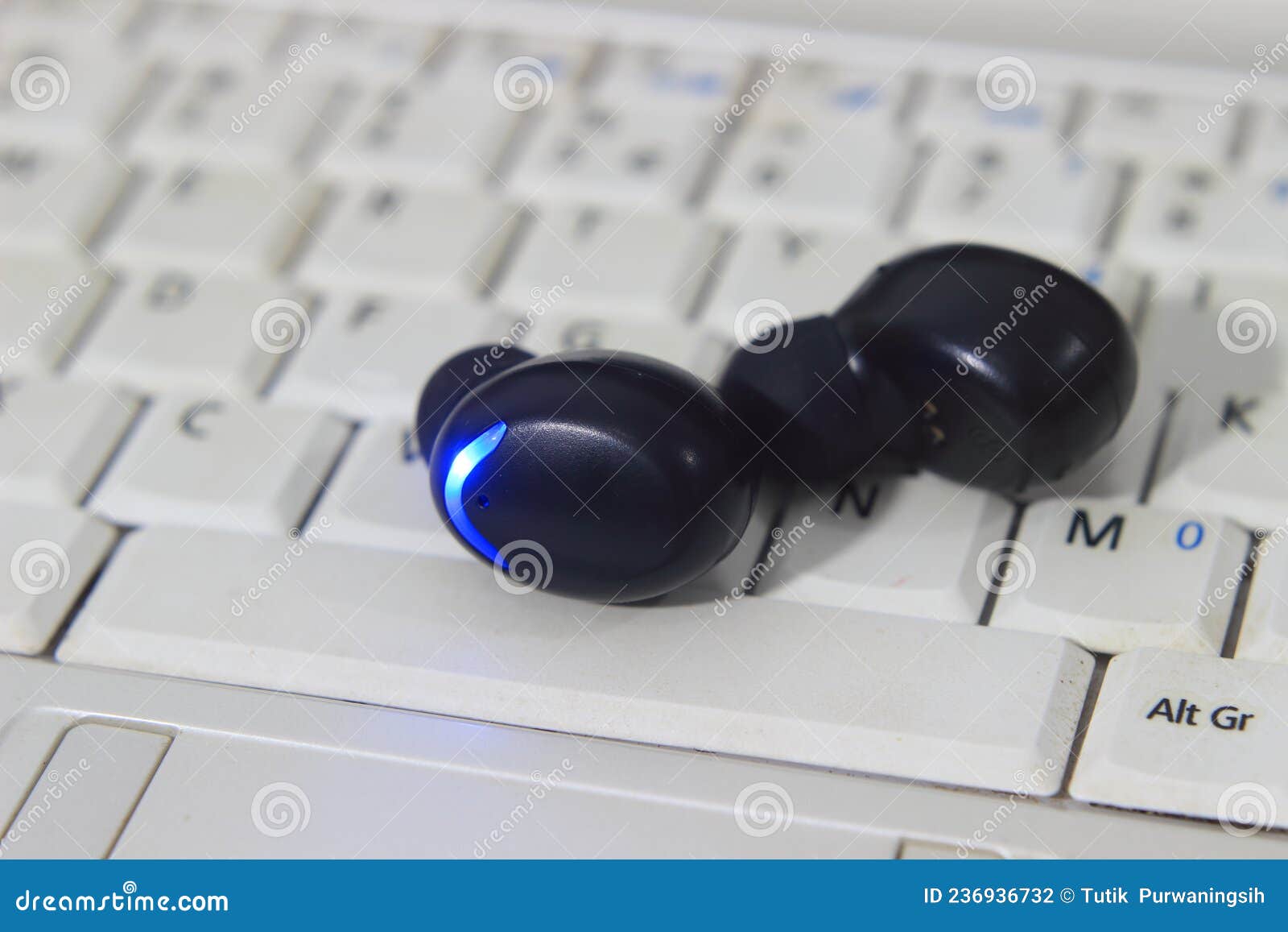 Close Up TWS or True Wireless Stereo at White Notebook Stock Photo ...