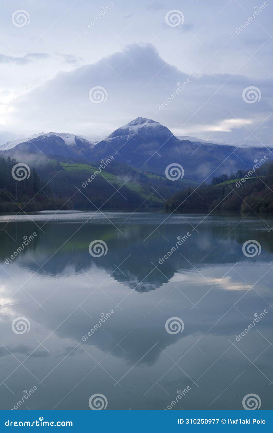 Txindoki with Snow. Mount Txindoki Reflected in the Ibiur Reservoir ...