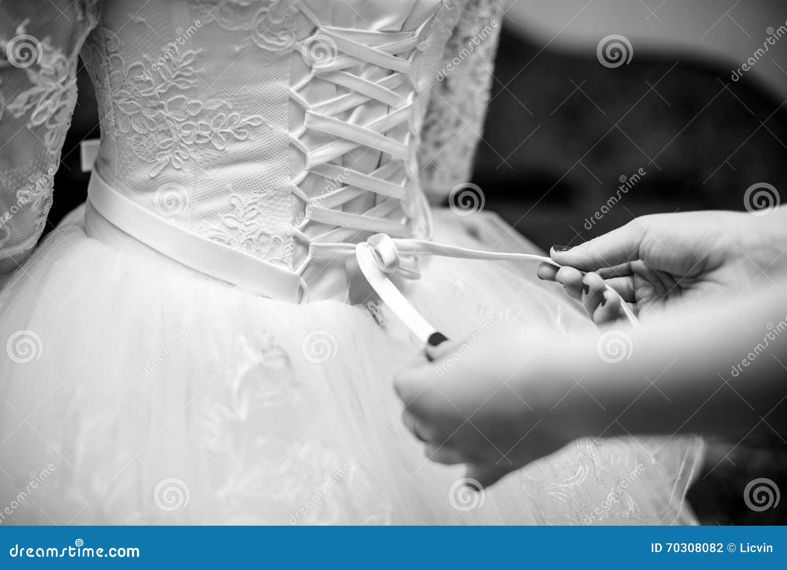 Tying a corset to bride stock photo. Image of tying, veil - 70308082