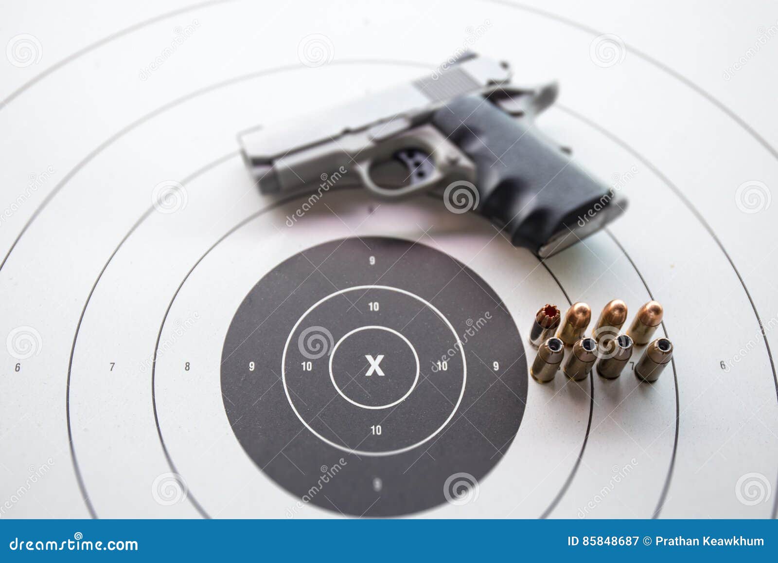 Type of .45 Bullets on Bullseye Target with Blurred Pistol Stock Image ...