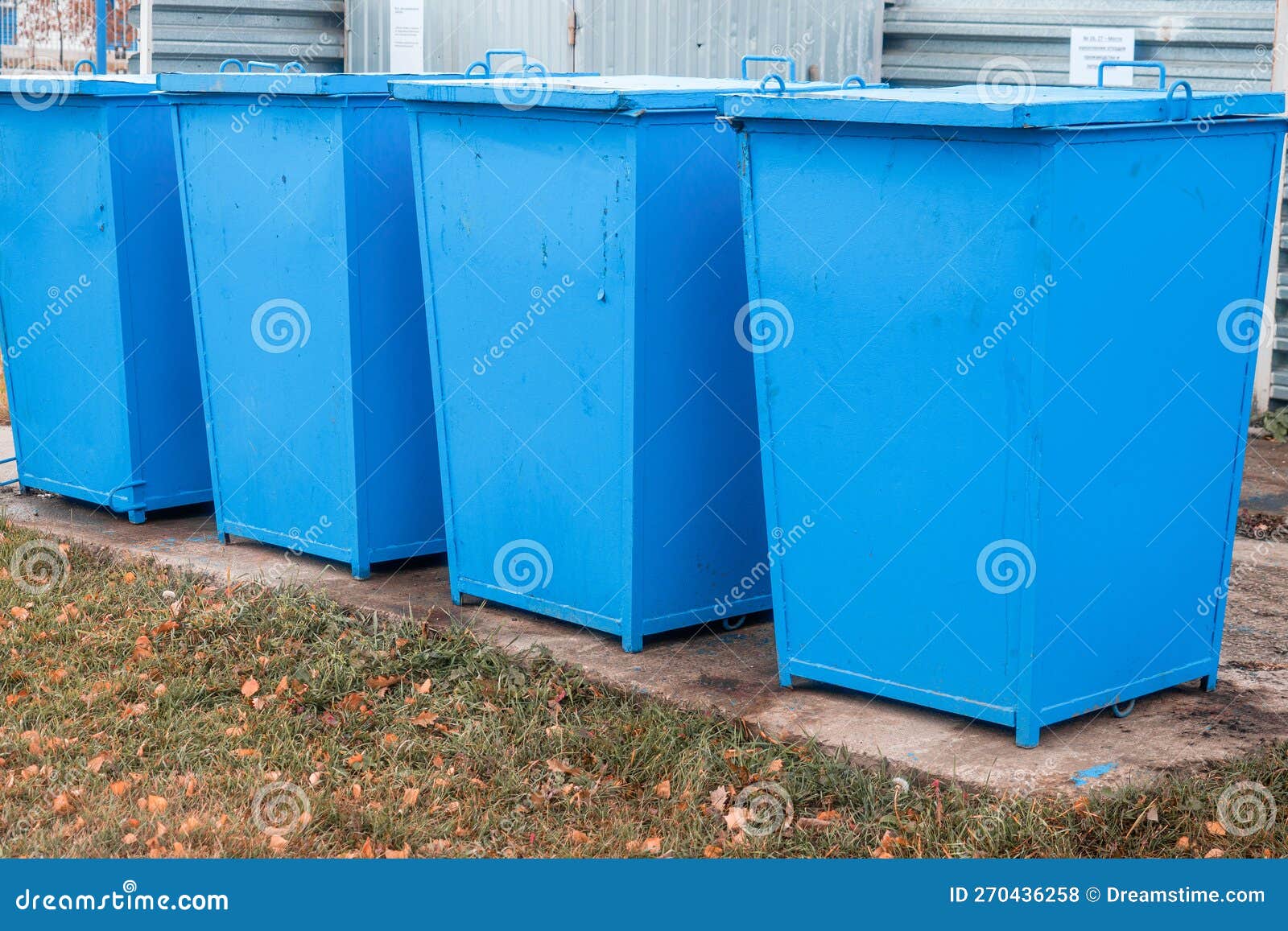 Type of Garbage Cans. Metal Dumpsters Stand in Row on Special Site ...