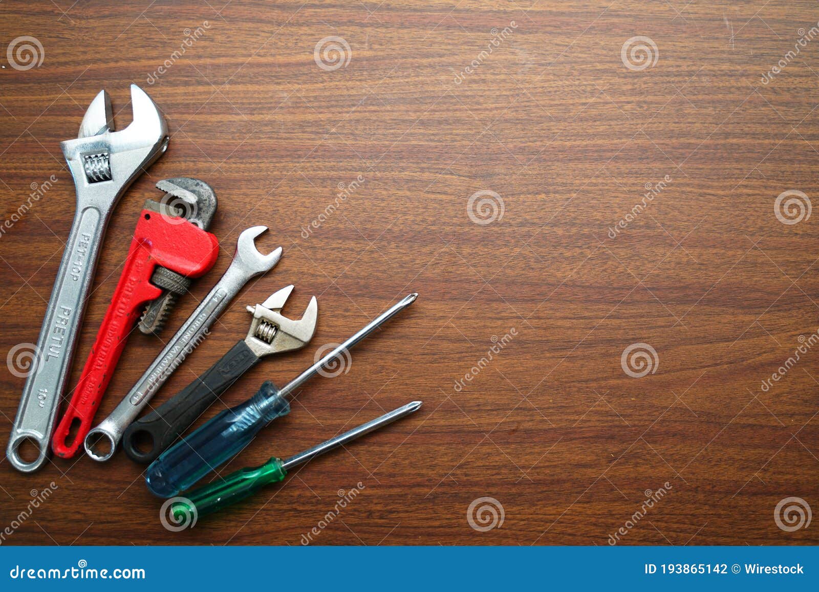 Types of Adjustable Wrenches and Other Tools on a Wooden Table Stock ...