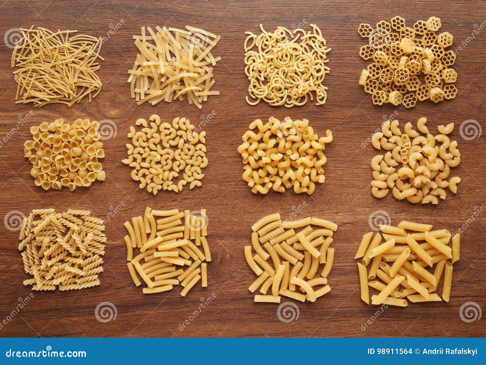 Types of Dry Pasta on Dark Wooden Table, Top View Stock Photo - Image ...