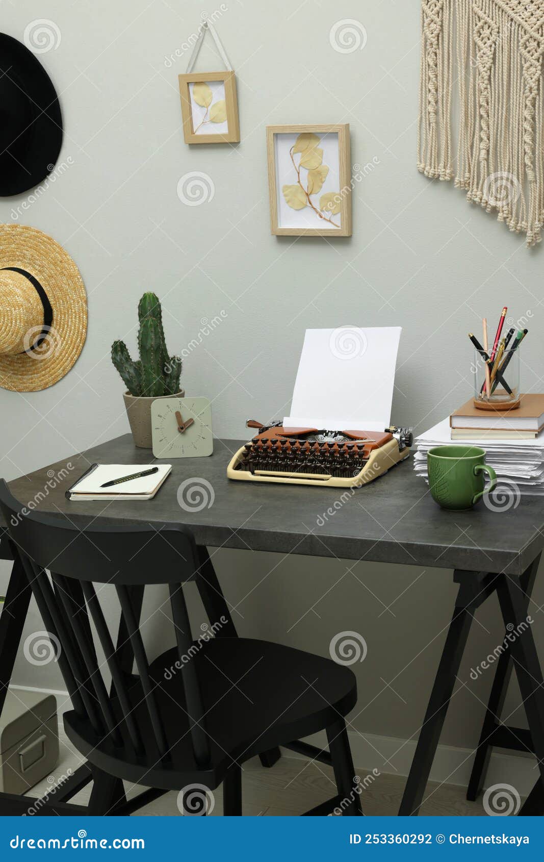 Typewriter and Stack of Papers on Table in Room. Writer`s Workplace ...