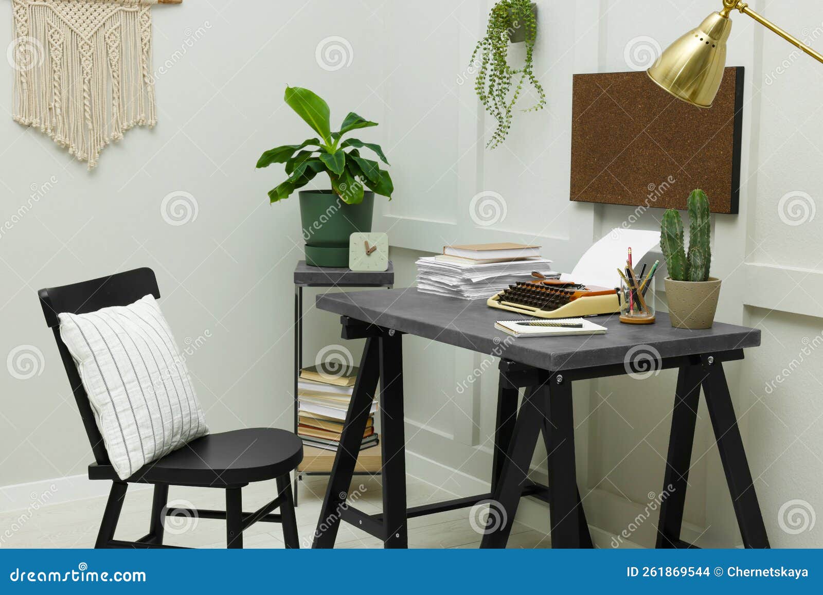 Typewriter and Stack of Papers on Dark Table in Room. Writer`s ...