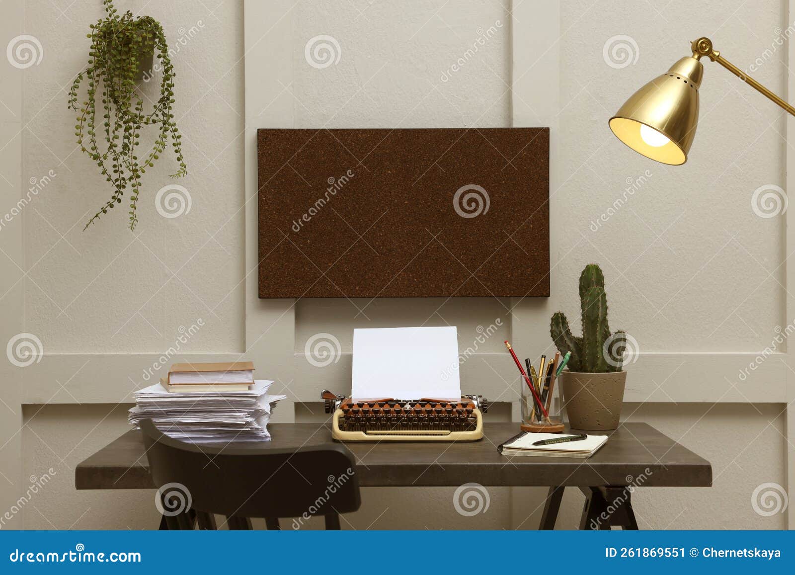 Typewriter and Stack of Papers on Dark Table in Room. Writer`s ...
