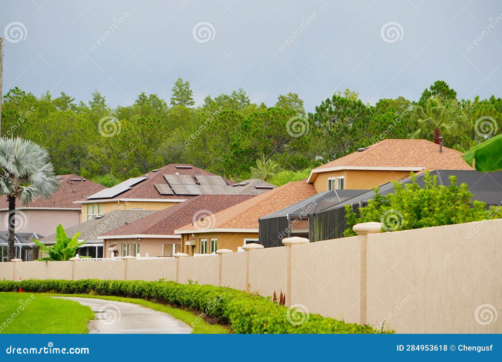 A Typical Florida Community, Wall and Road Stock Photo - Image of palm ...