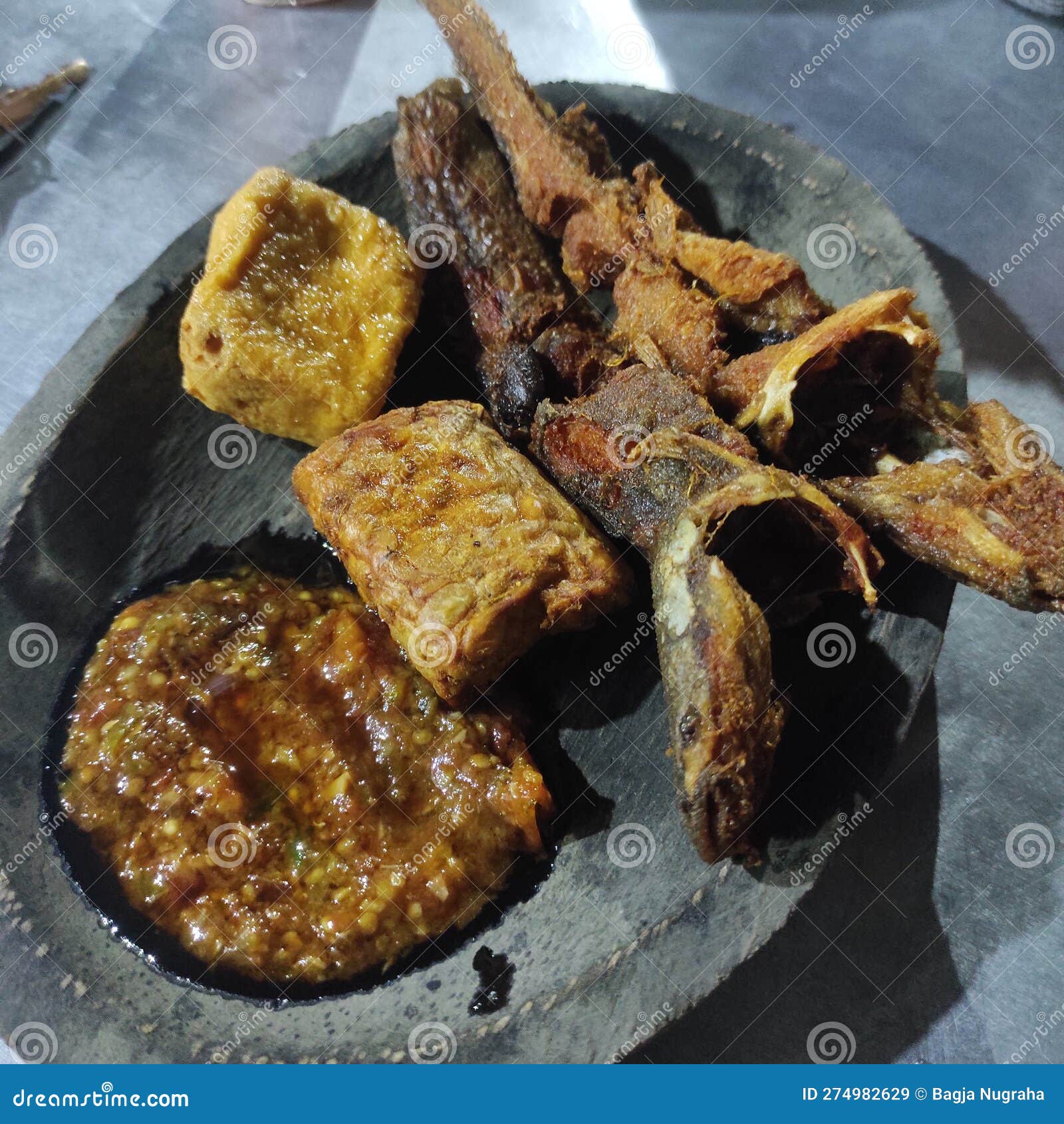 Typical Food from East Java Pecel Lele. Dry Fried Catfish Served with ...