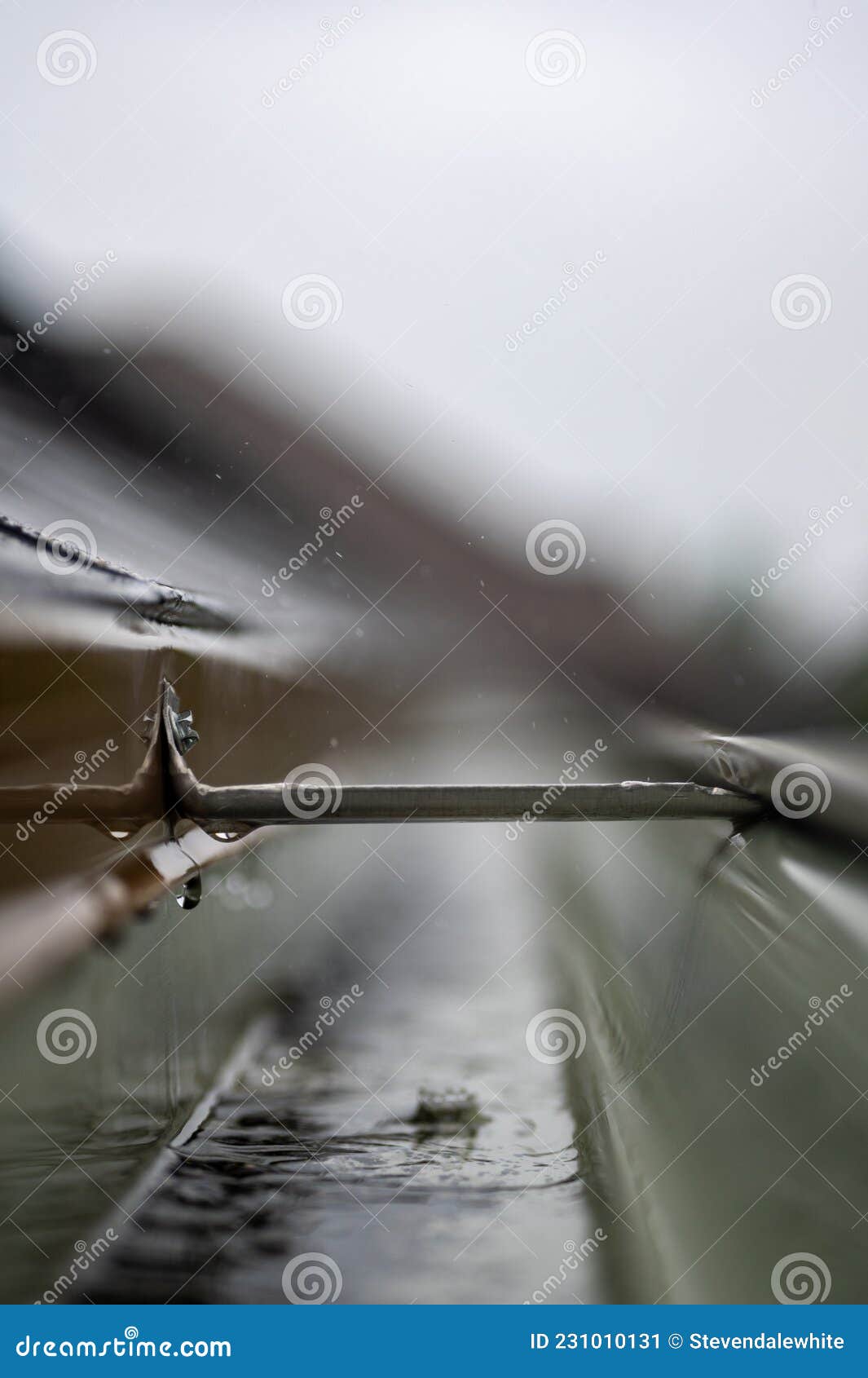 Selective Focus on a Section of Residential Guttering with Hanger ...