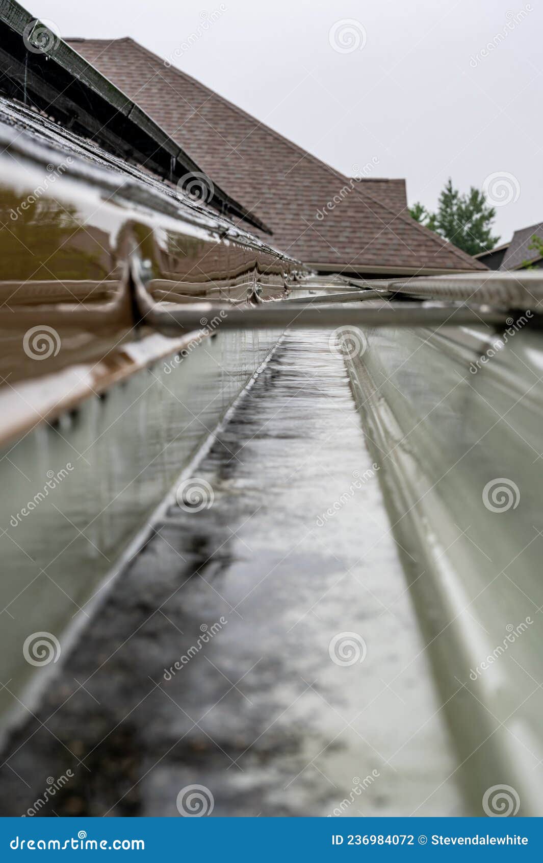 Selective Focus on a Section of Residential Guttering with Hanger ...