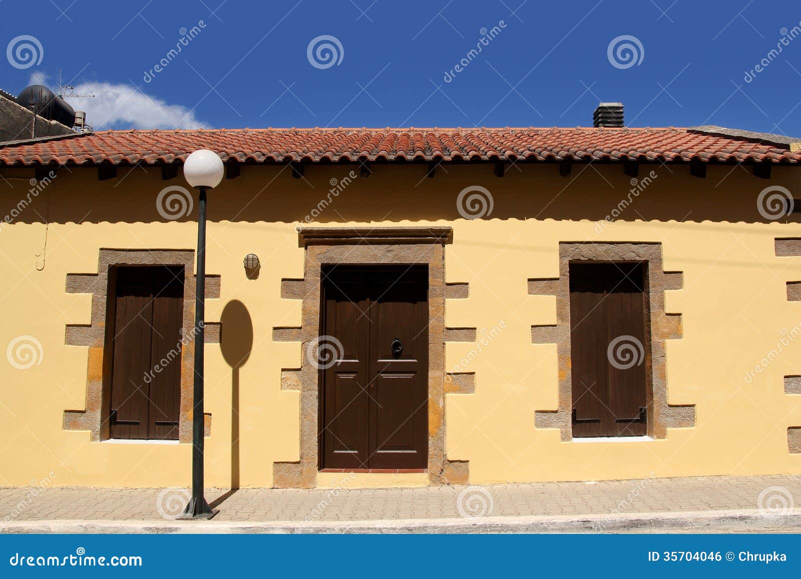 Typical Greek House with Yellow Painted Wall Stock Photo - Image of ...
