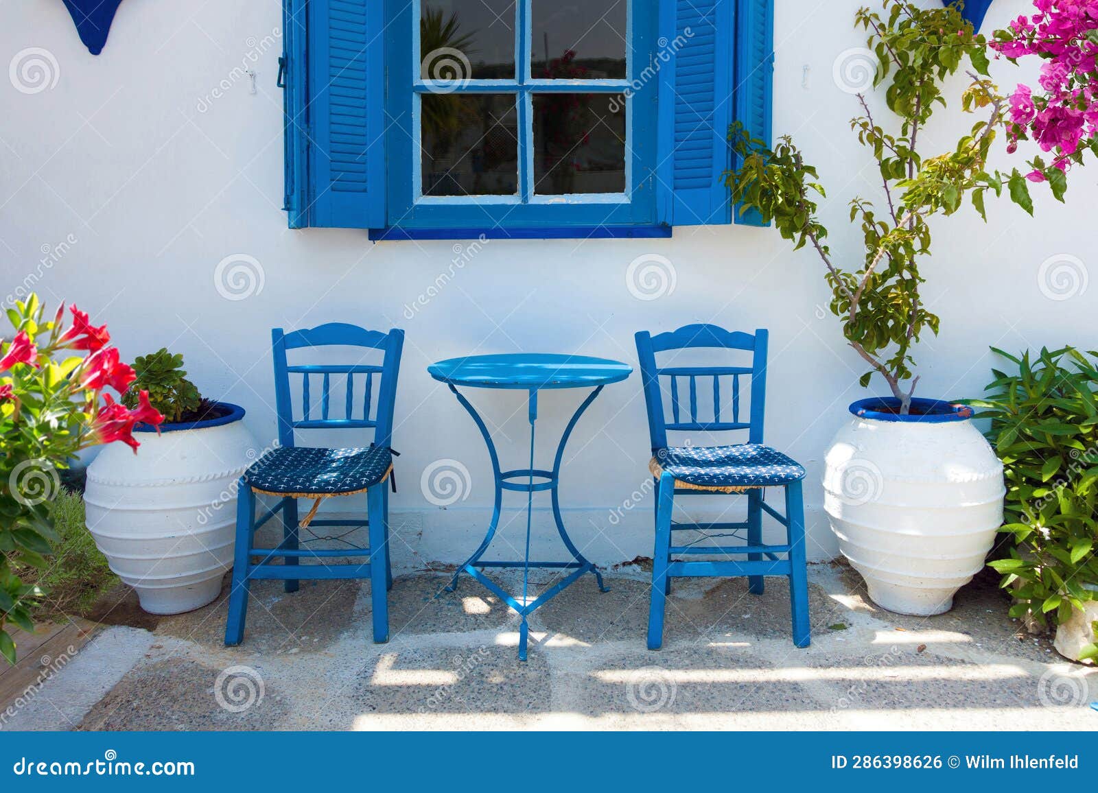 Typical Greek Outdoor Still Live with Blue Table and Chairs Stock Photo ...