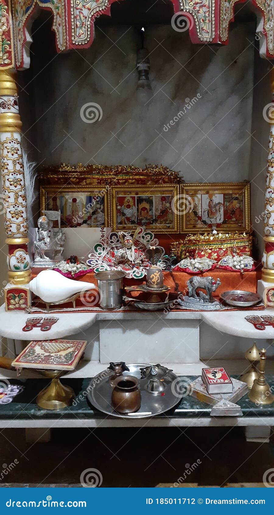 A Typical Indian Home Temple with Idols and Frames of Many Gods and ...