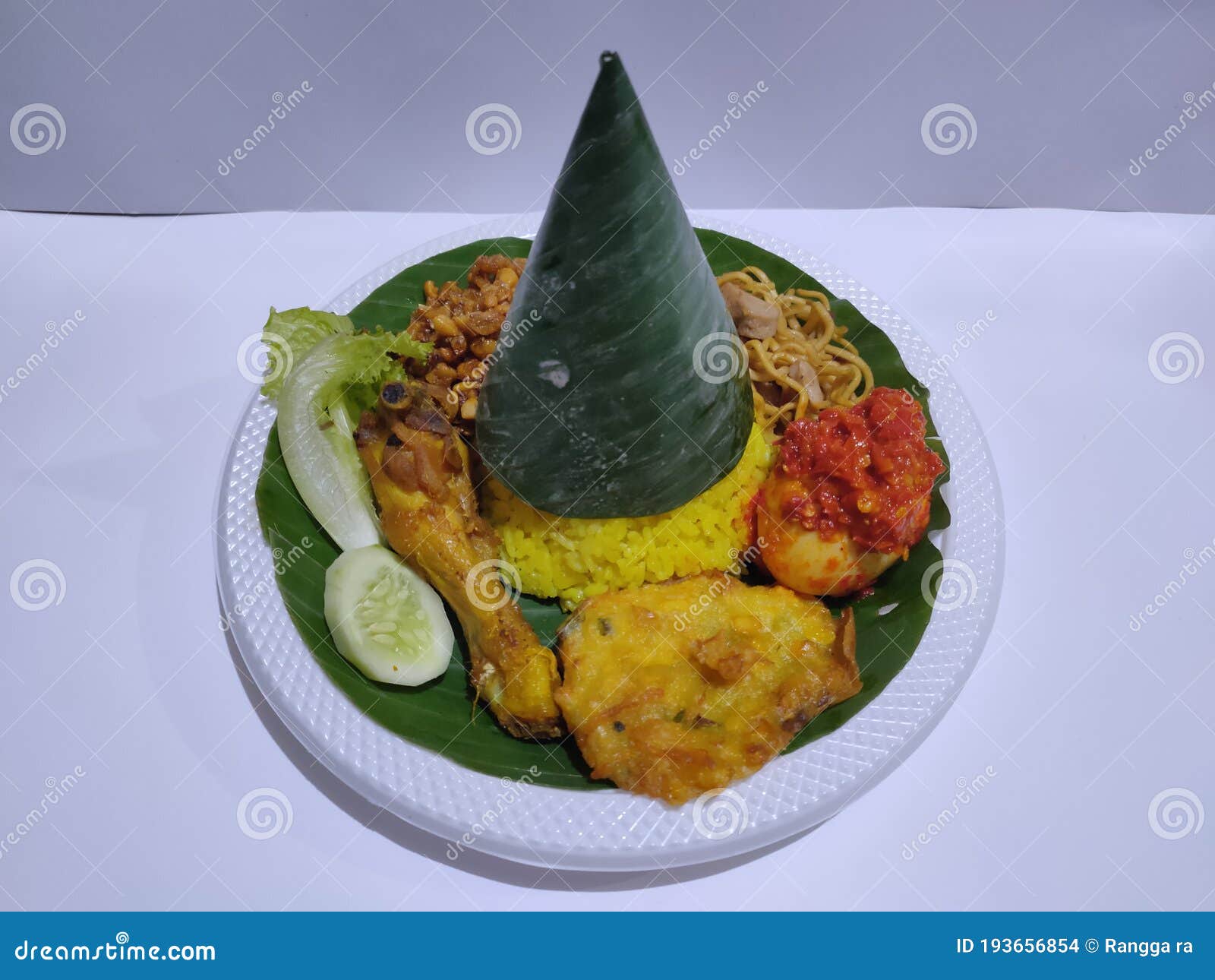 Typical Indonesian Yellow Rice, with Fried Chicken, Eggs and Noodles ...
