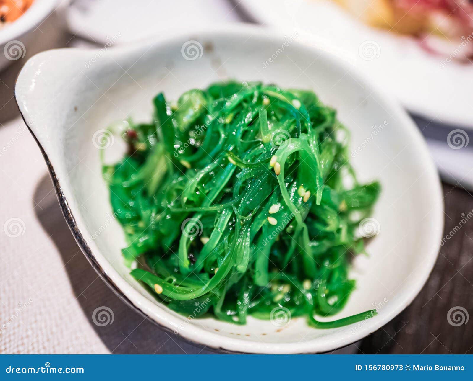 Typical Japanese Dish of Algae with Sesame and Soy Sauce, in a Ceramic ...