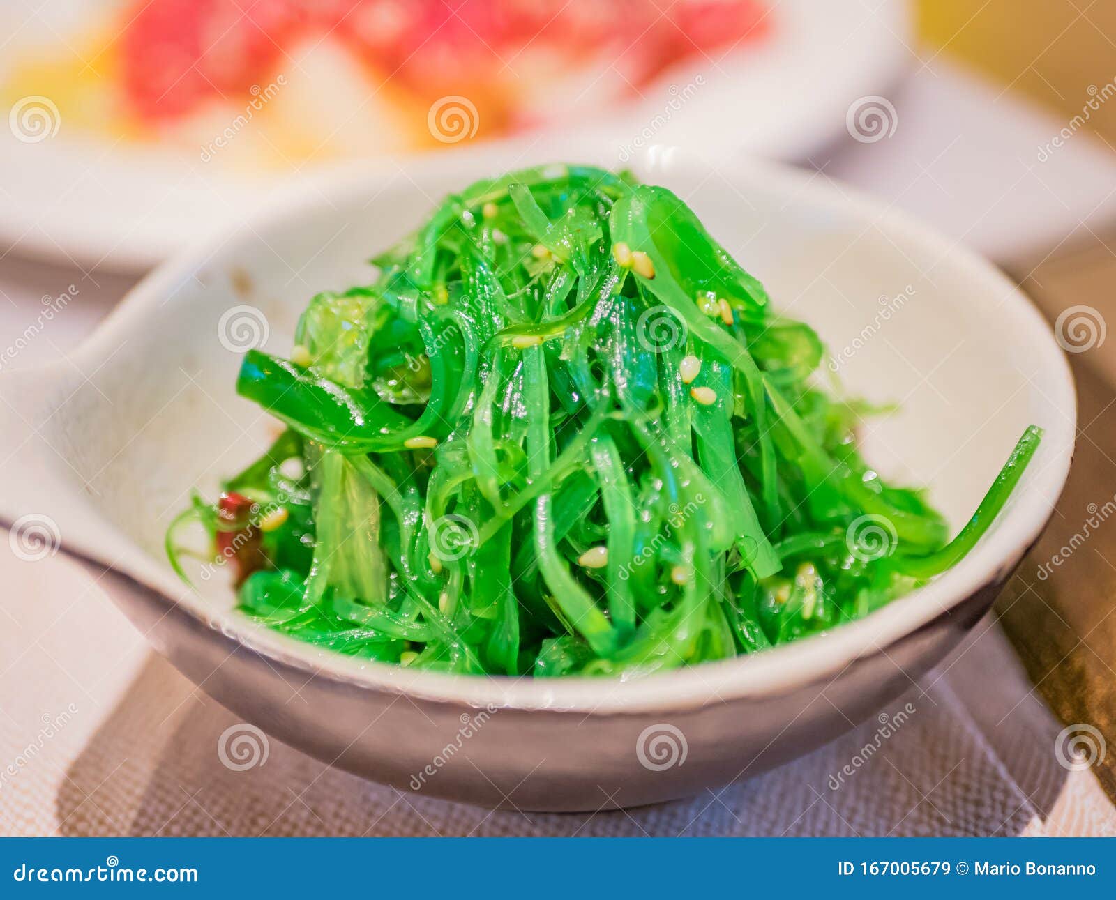 Typical Japanese Dish of Algae with Sesame and Soy Sauce, in a Ceramic ...