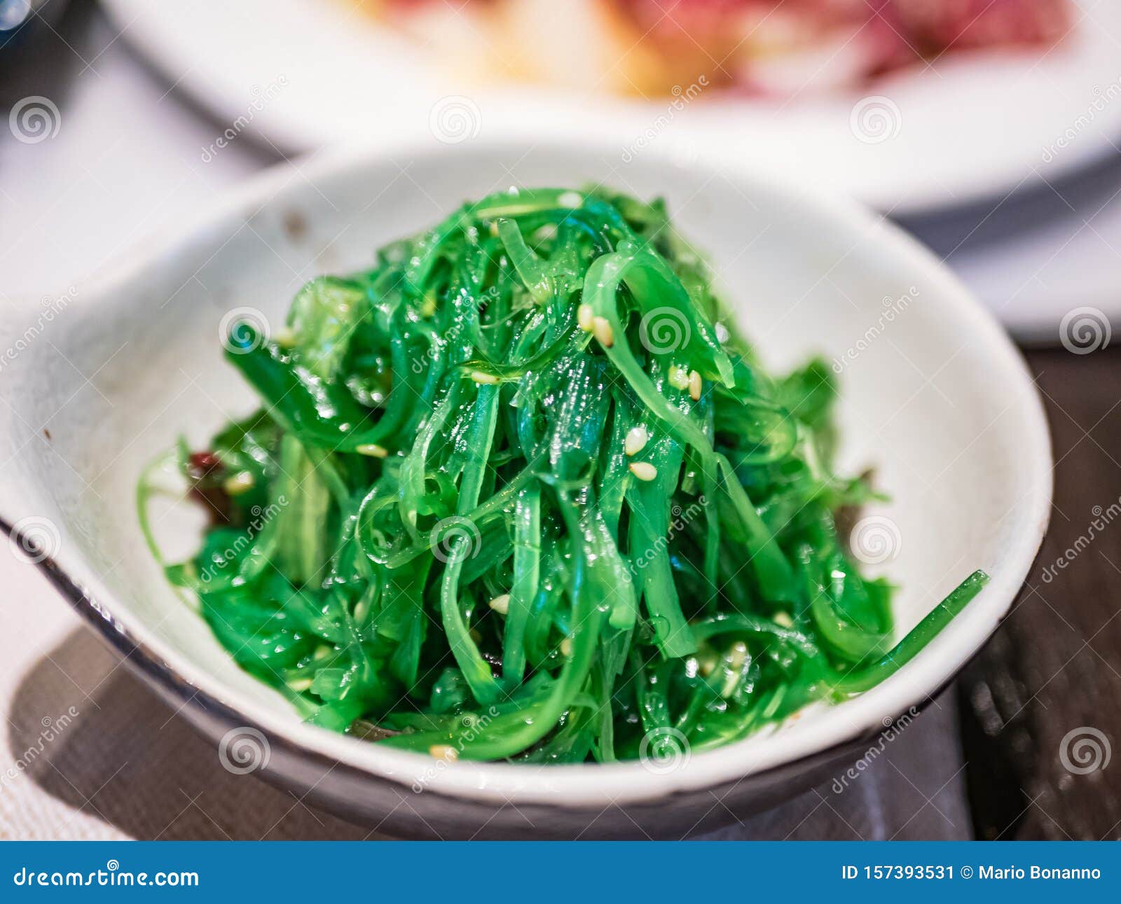 Typical Japanese Dish of Algae with Sesame and Soy Sauce, in a Ceramic ...