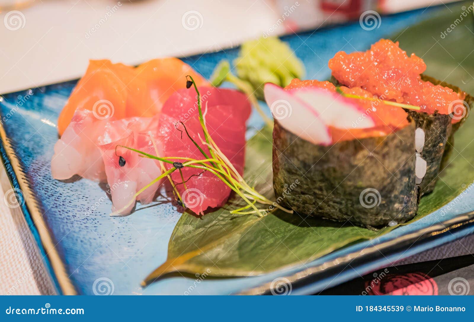 Typical Japanese Dish of Sushimi and Onighiri on a Leaf of Bamboo Stock ...