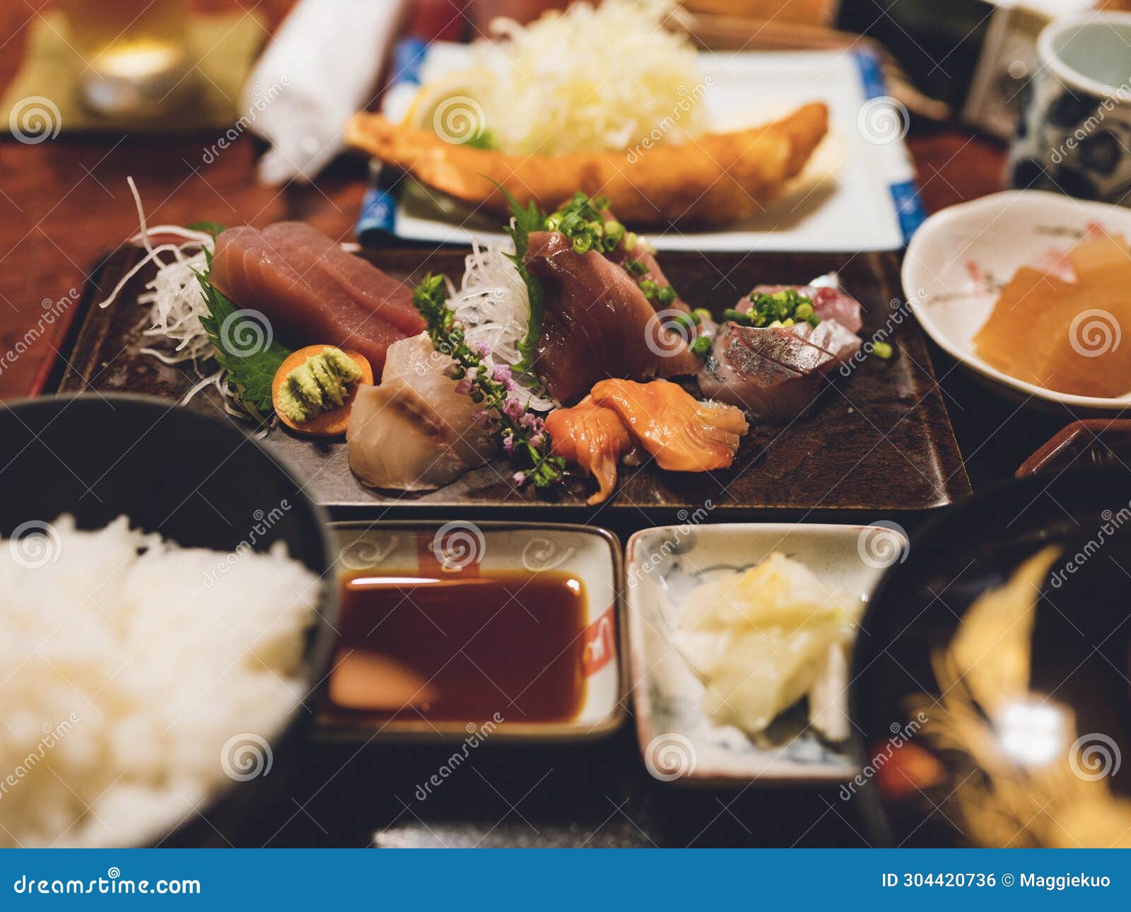 Sashimi Lunch Set Including Rice, Fish, and Several Small Side Dishes ...