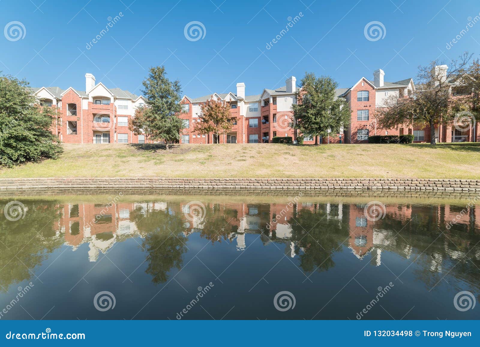 Typical Multi-story Riverside Apartment Complex with Fall Foliage in ...