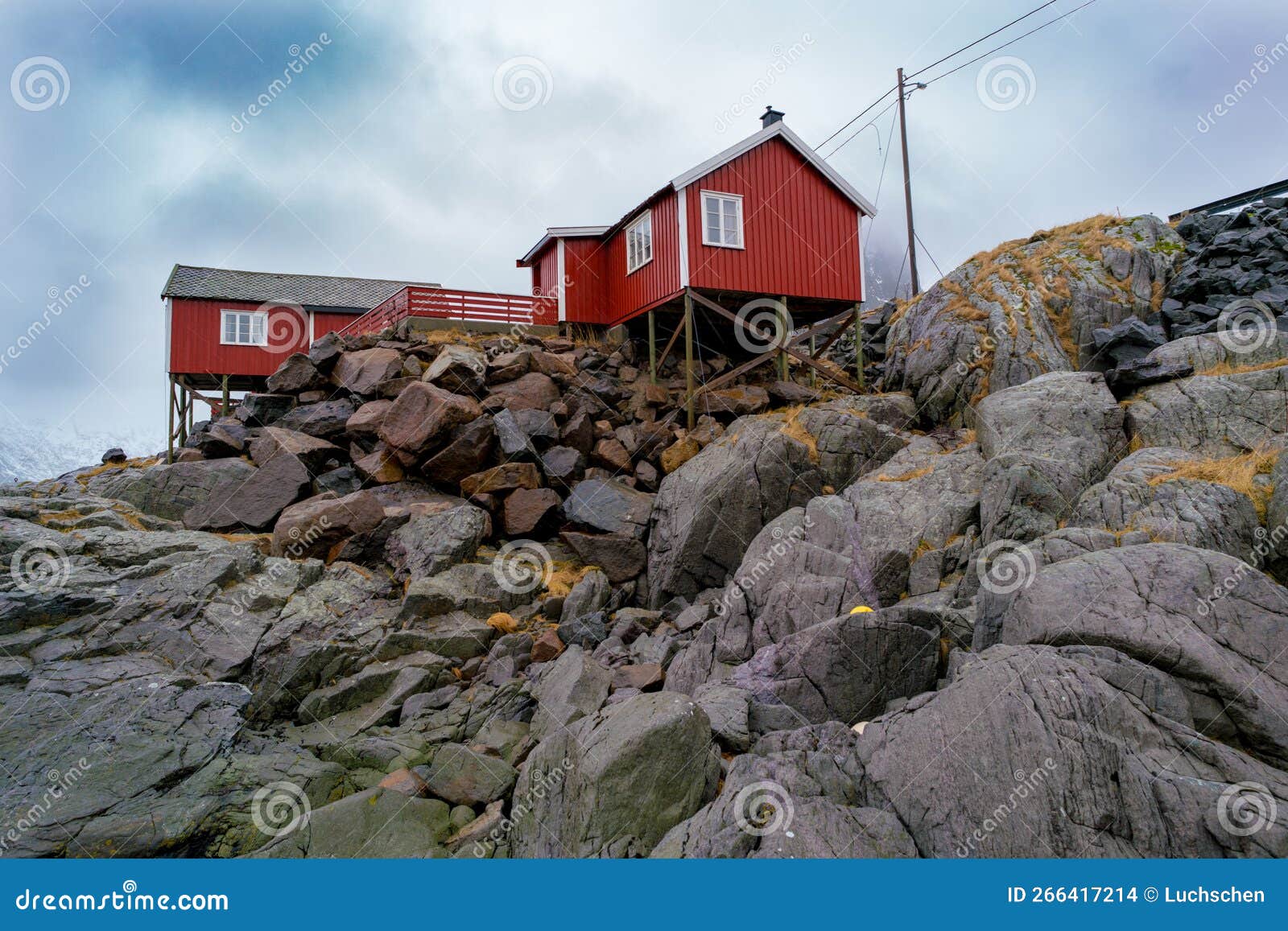 Typical Norwegian Red Houses on Stone Cliffs in the Fjords Stock Photo ...