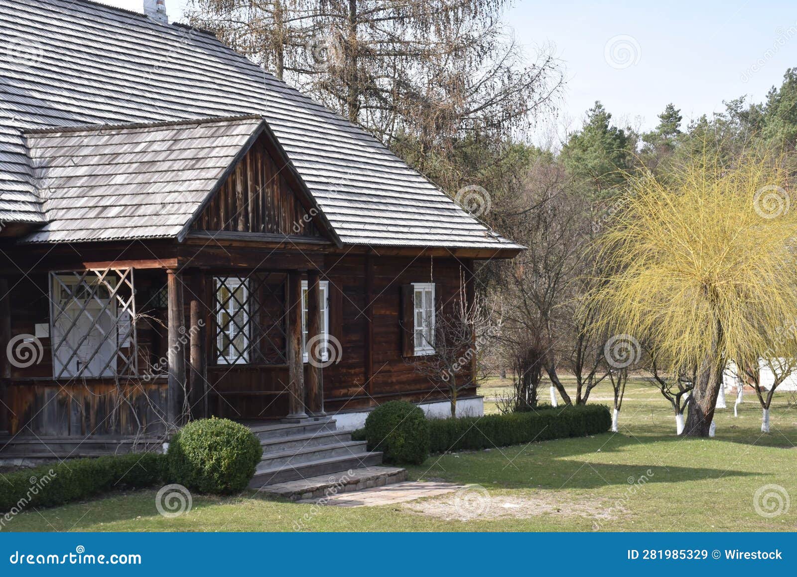 Typical Polish Wooden Manor Surrounded by Lush Trees. Stock Image ...