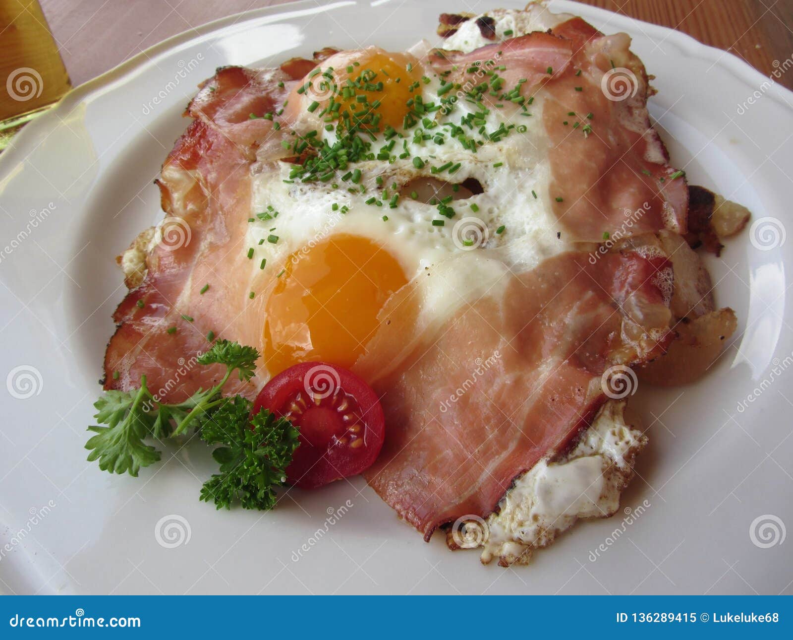 Typical South Tyrolean Dish with Speck, Fried Eggs, Potatoes and Chive ...