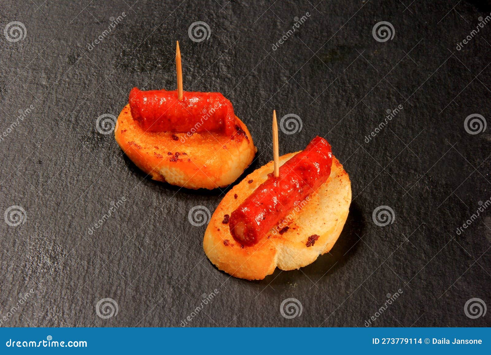 Typical Spanish Chorizo Tapas. Pork Sausage Called Chistorra on Bread ...