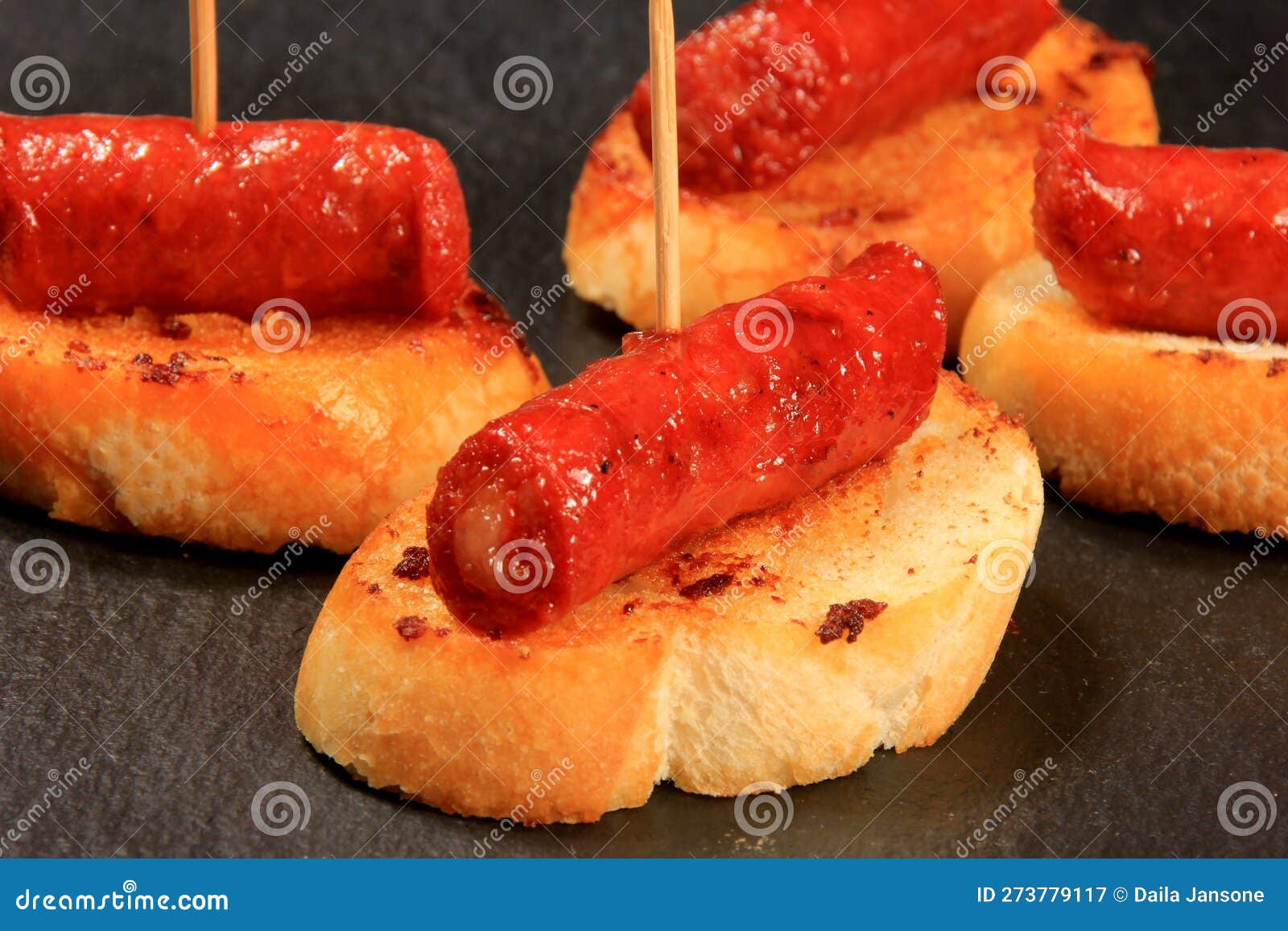 Typical Spanish Chorizo Tapas. Pork Sausage Called Chistorra on Bread ...