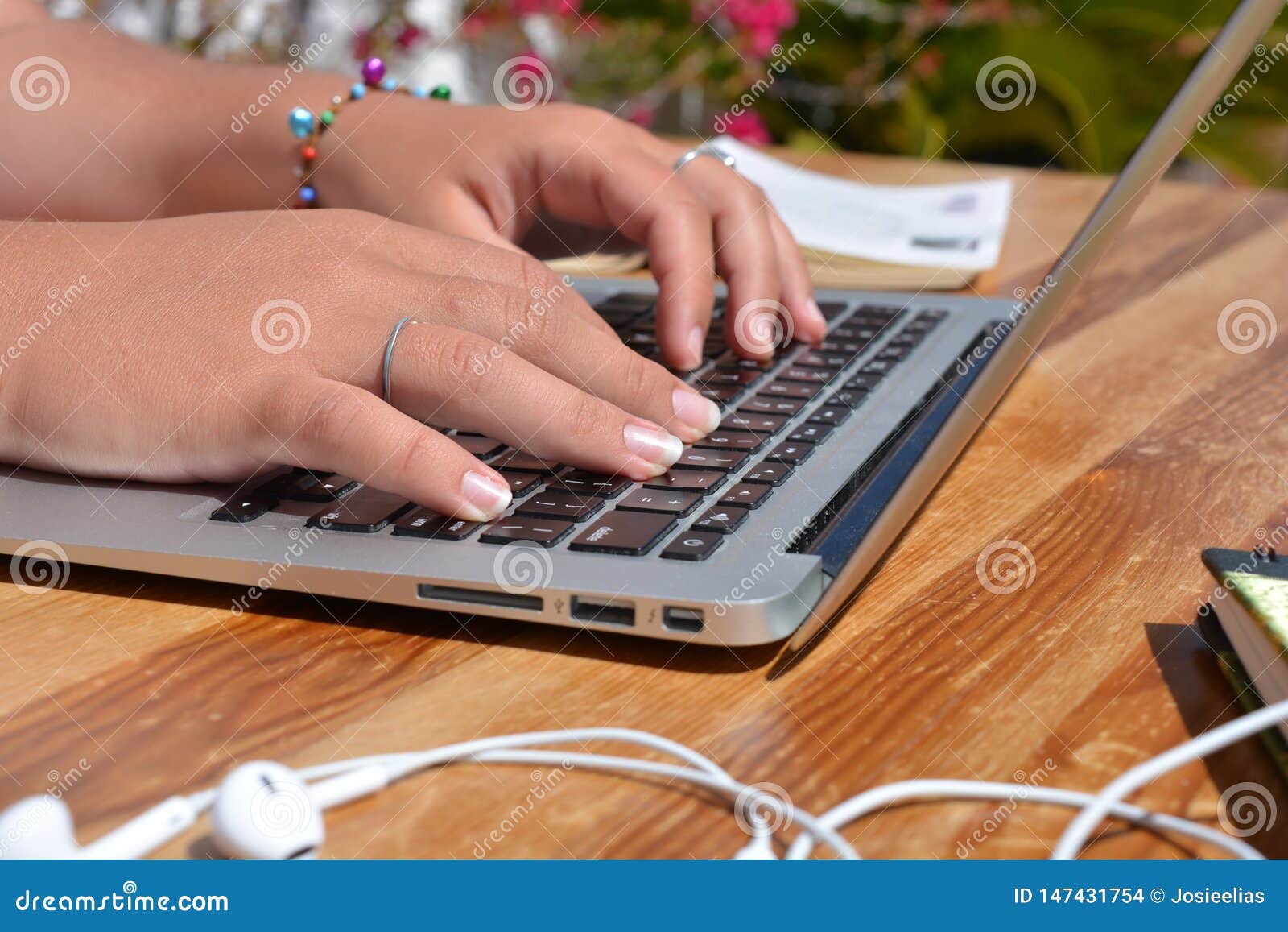 Typing on a Laptop Keyboard Stock Photo - Image of earphones, hand ...