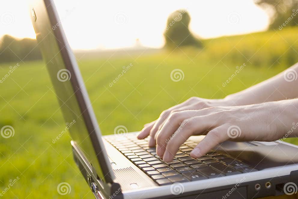 Typing on a laptop outside stock image. Image of internet - 1859377
