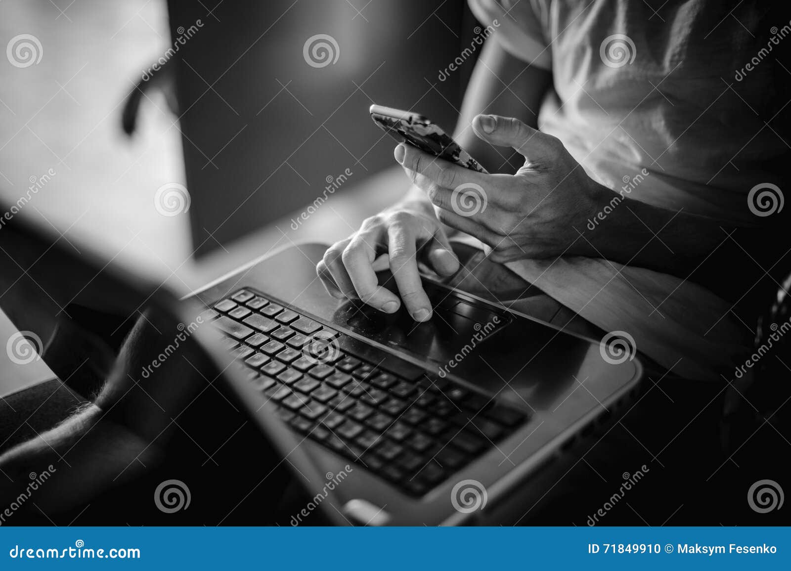 Typing Male Hands on Laptop Keyboard and Holding Cell Phone Stock Photo ...