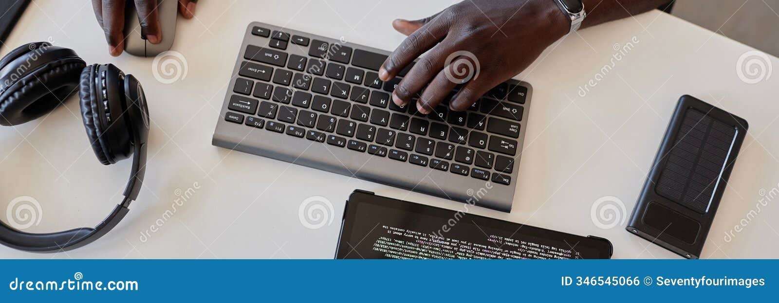 Typing on Wireless Keyboard while Typing Code on Tablet Stock Photo ...