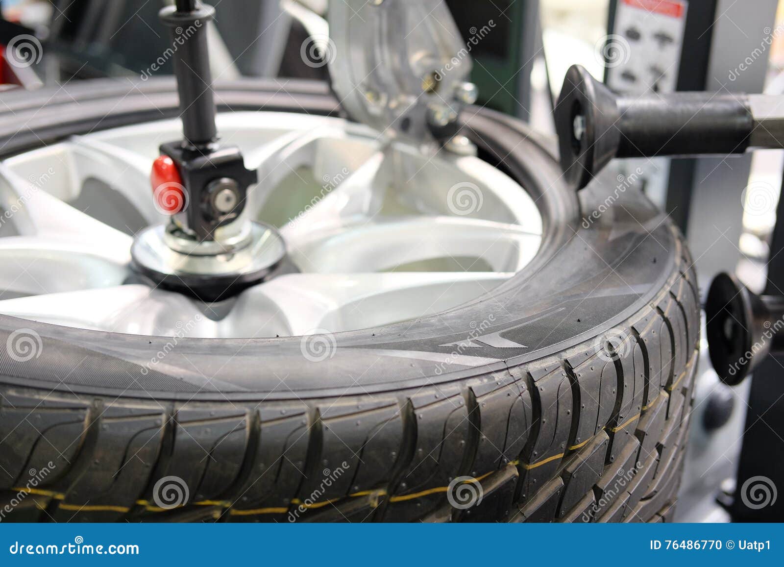 Tyre fitting machine stock photo. Image of automobile - 76486770