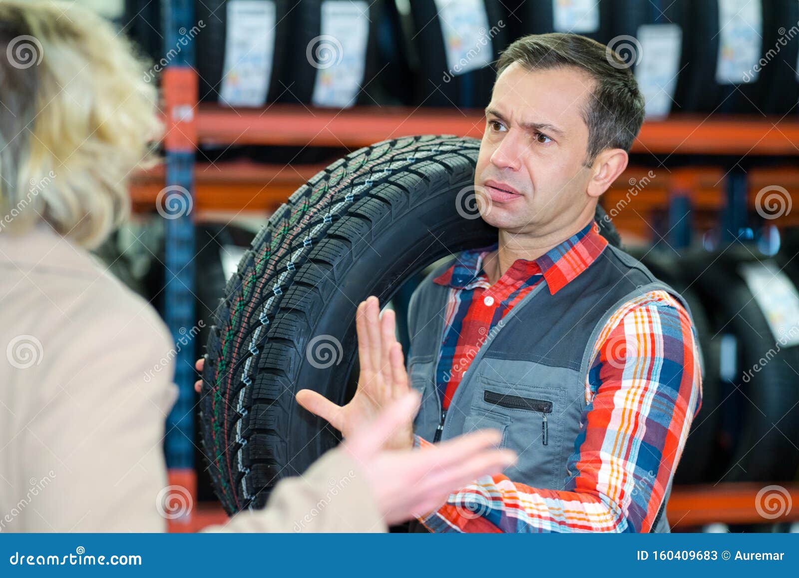 Tyre Mechanic Dealing with Angry Customer in Garage Stock Image - Image ...